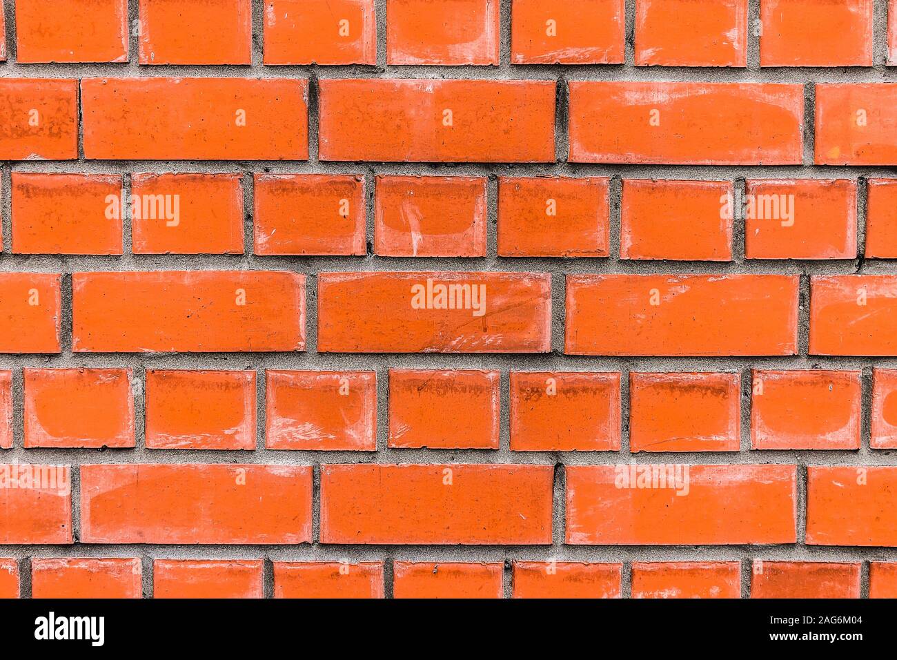 Texture or background wall of a classic red brick with scratches and ...