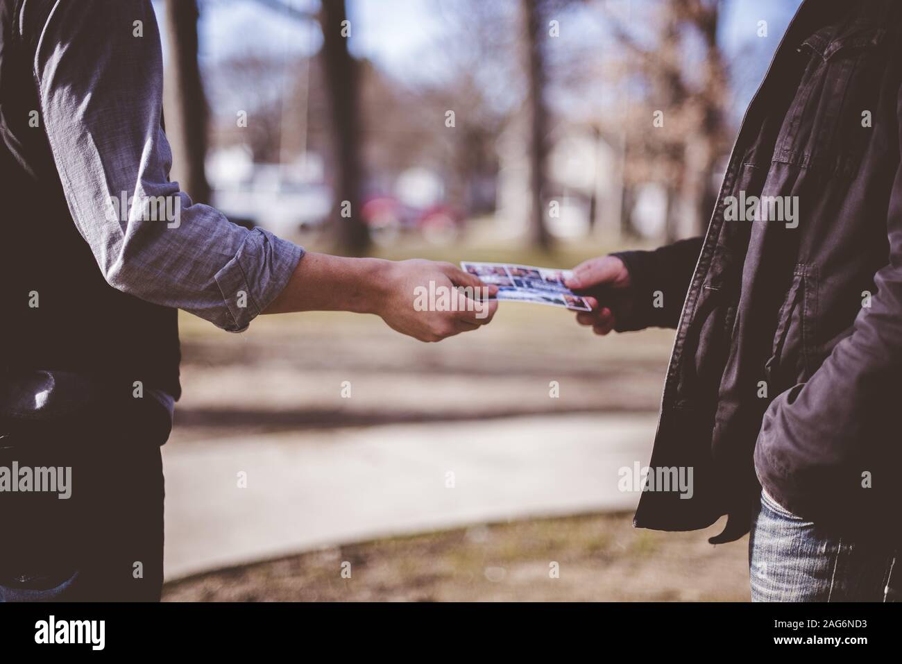 Man handing out leaflet hi-res stock photography and images - Alamy