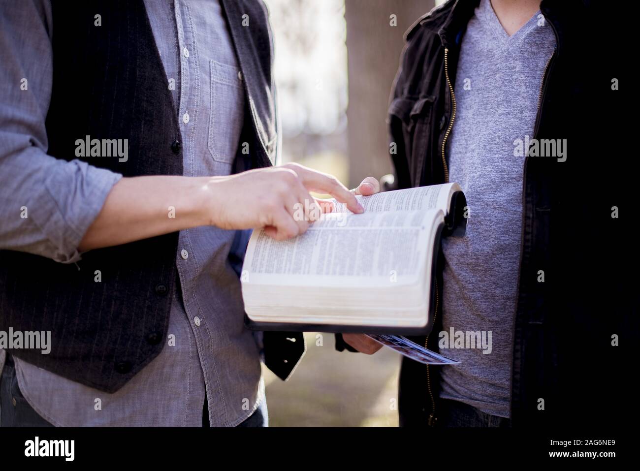 Pointing to the bible hi-res stock photography and images - Alamy