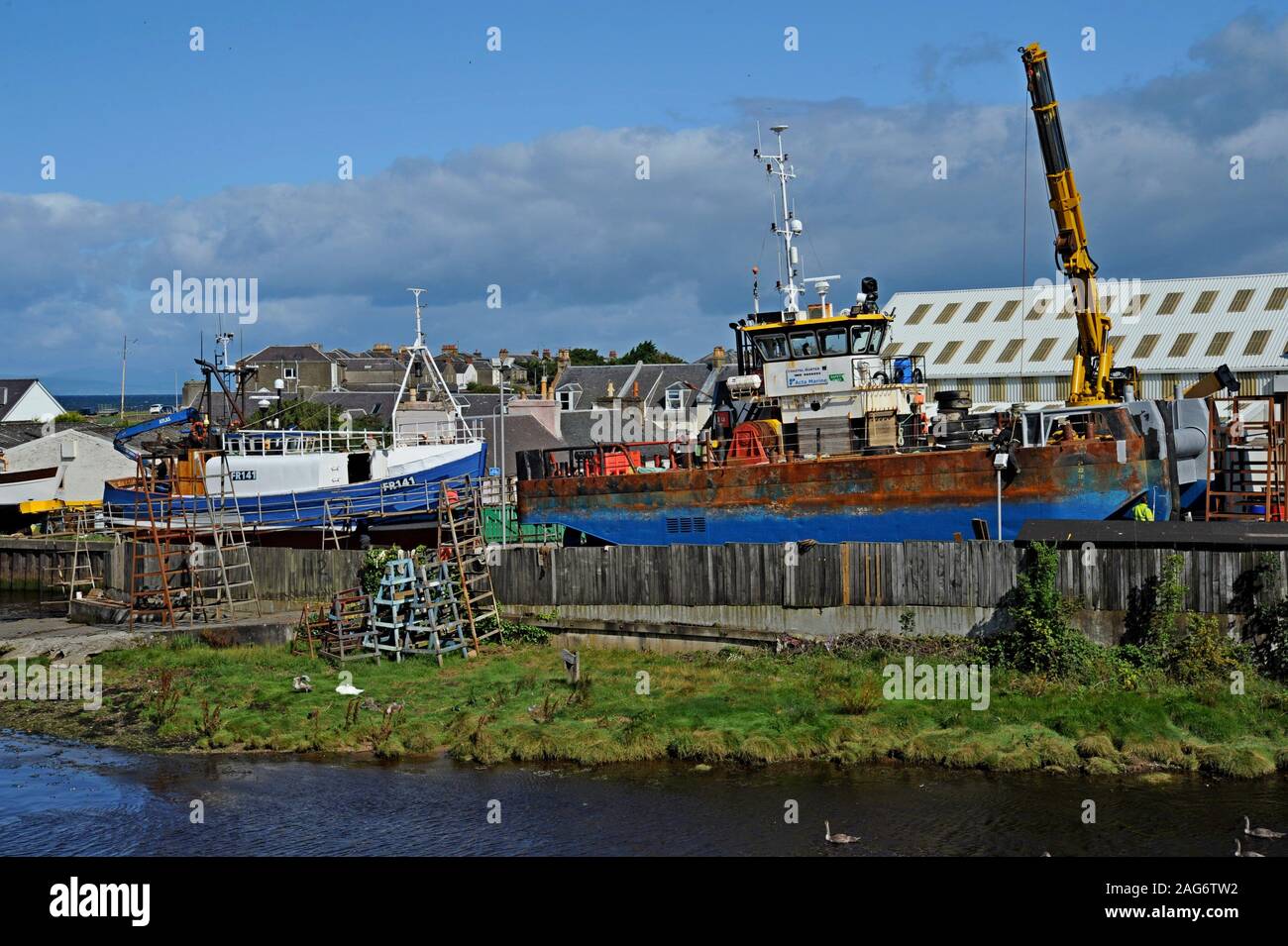Boats under repair on the slipway at Girvan dockyard and harbour ...