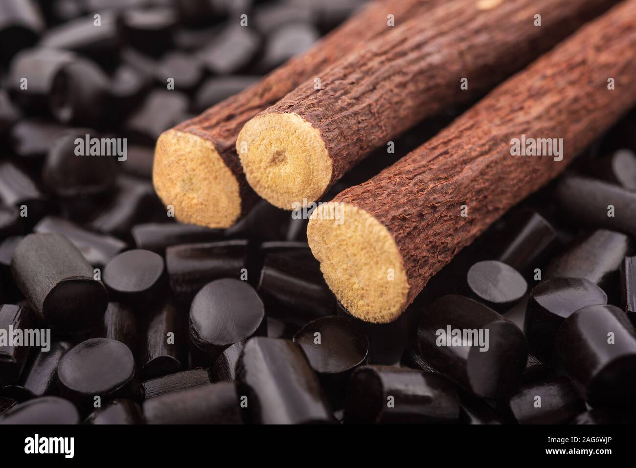 licorice candy and roots isolated on white background Stock Photo - Alamy