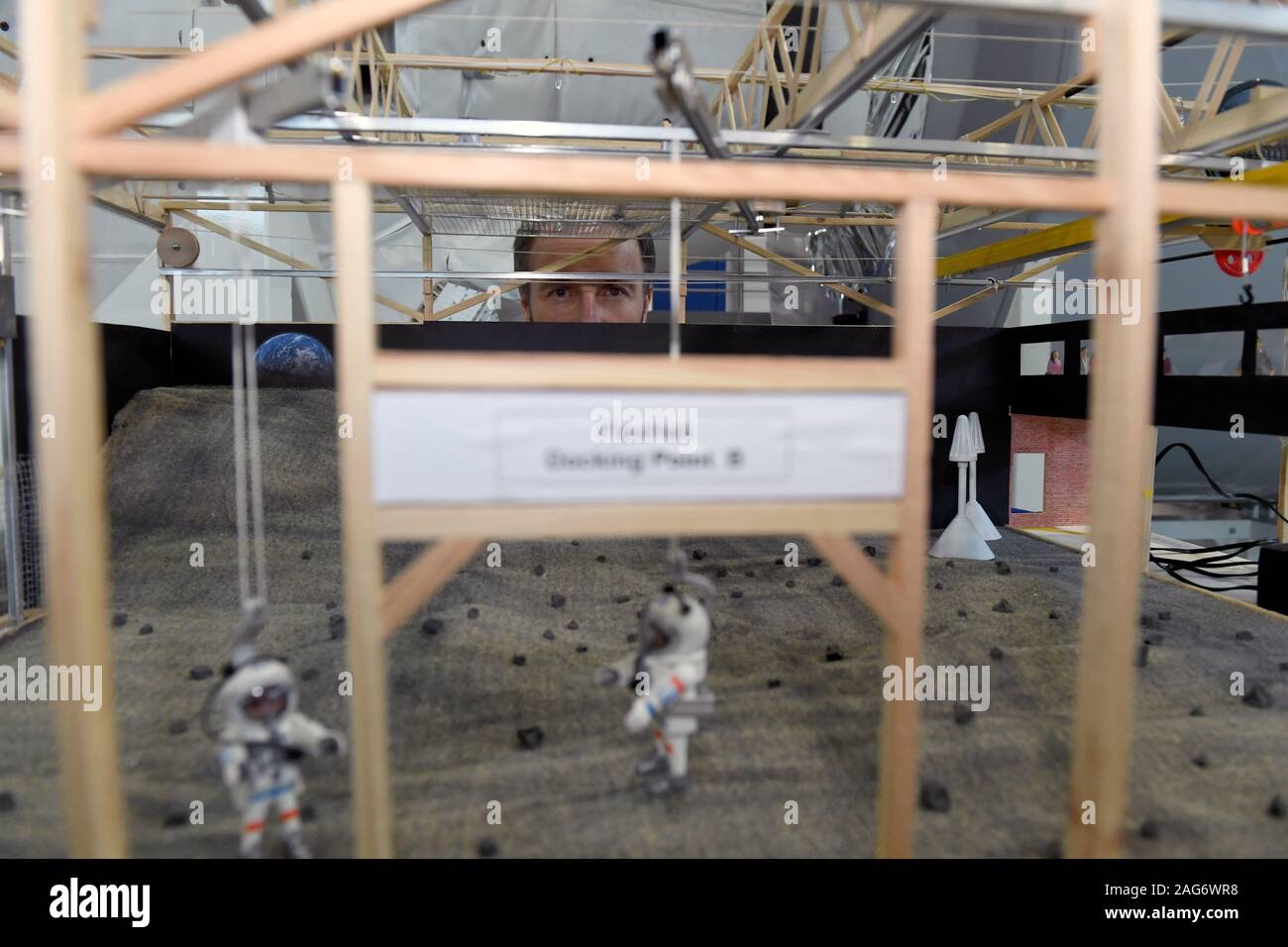 Cologne, Germany. 10th Dec, 2019. Astronaut Matthias Maurer observes ...
