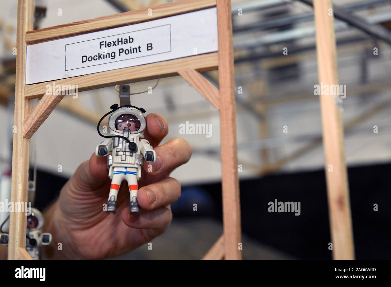 Cologne, Germany. 10th Dec, 2019. Astronaut Matthias Maurer holds a ...