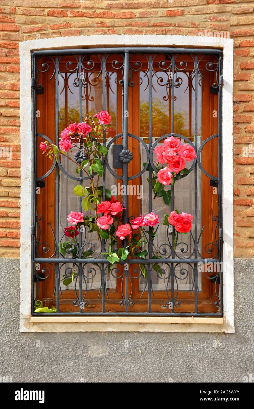 window decorated with pink flowers Stock Photo - Alamy