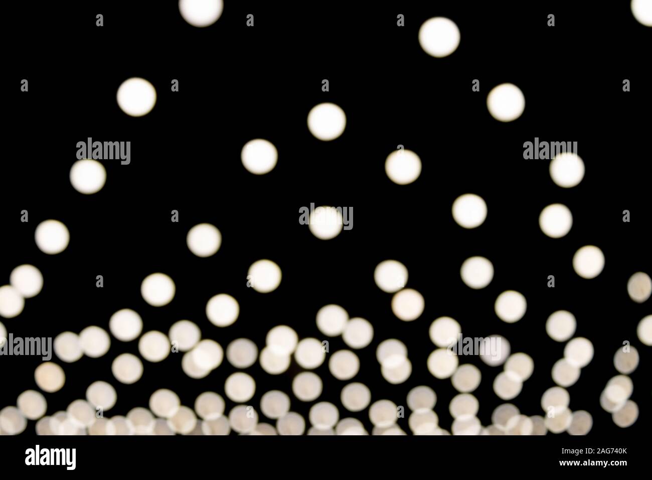 White Triangle Shape Blurred Lights on Black Background Stock Photo - Alamy