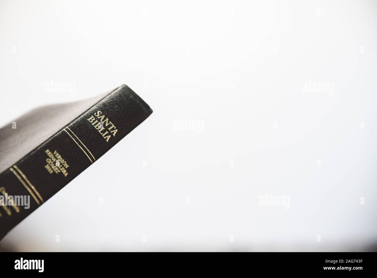 Closeup shot of the bible with a blurred white background Stock Photo ...