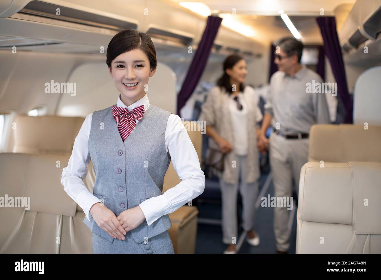 Chinese flight attendant passengers hi-res stock photography and images ...