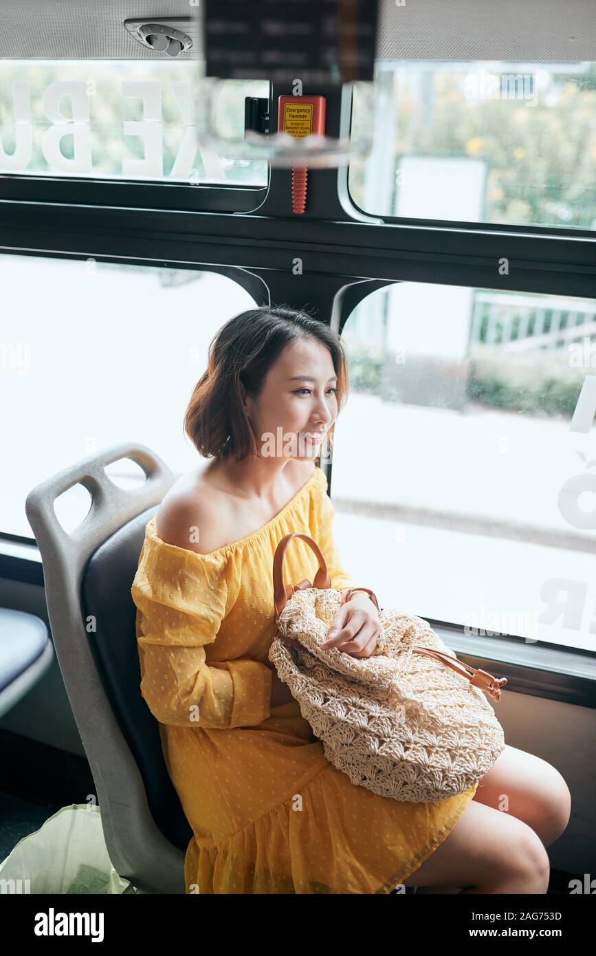 beautiful young woman taking bus to work Stock Photo - Alamy