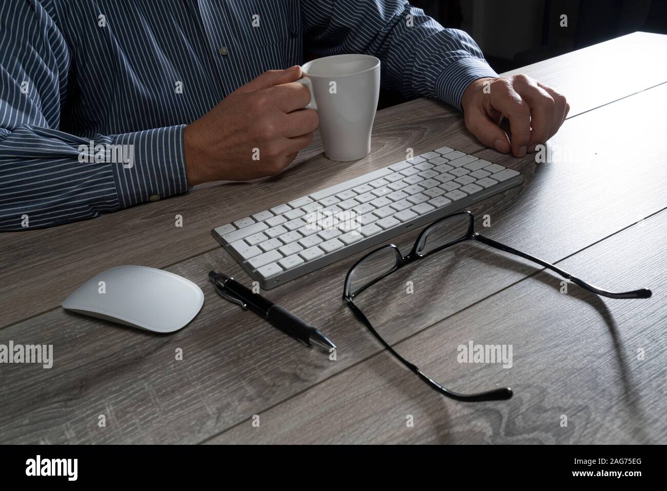drink coffee while working in front of the computer Stock Photo - Alamy