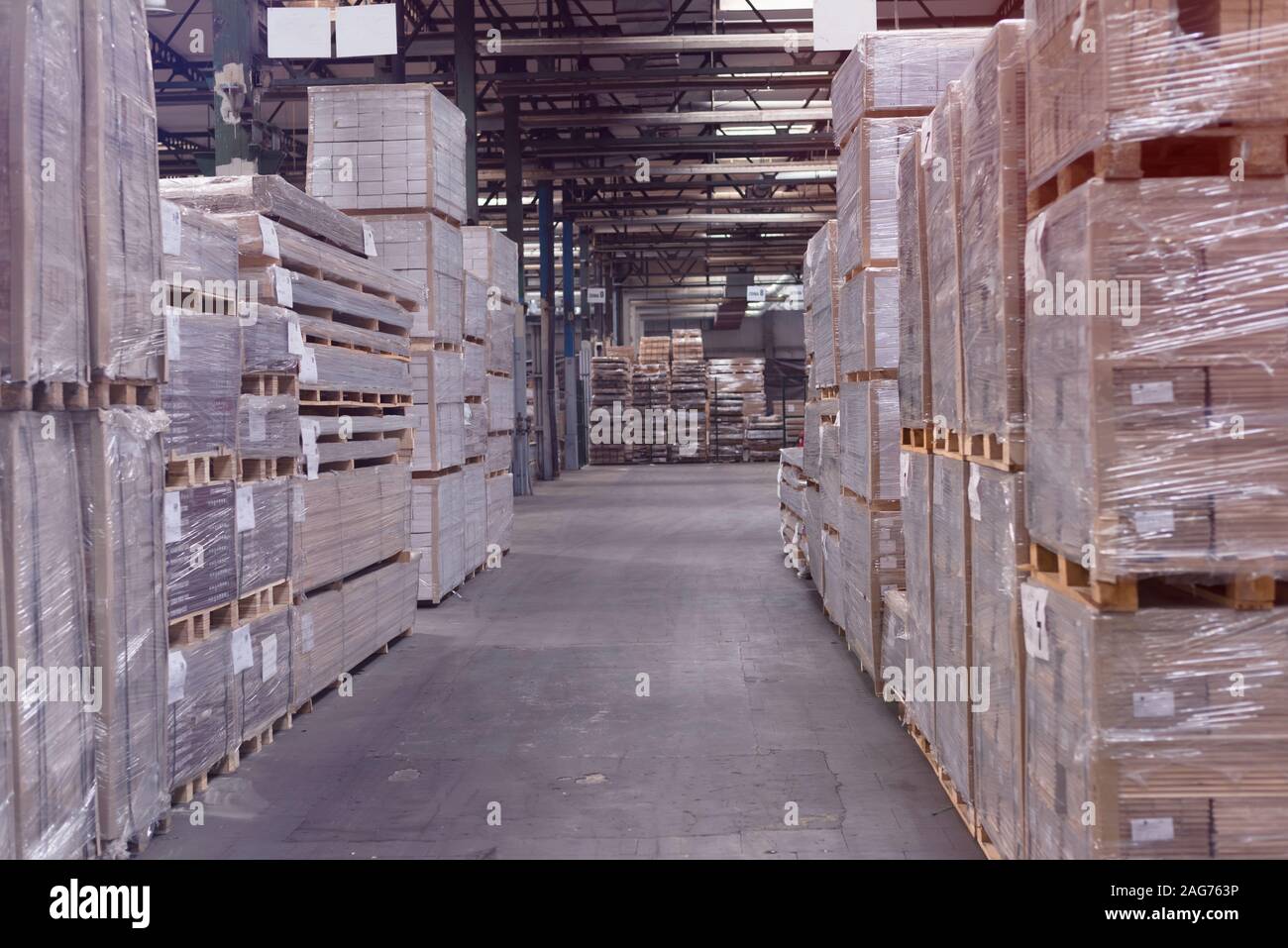 Production line of the wooden floor factory. Warehouse of boards in the ...