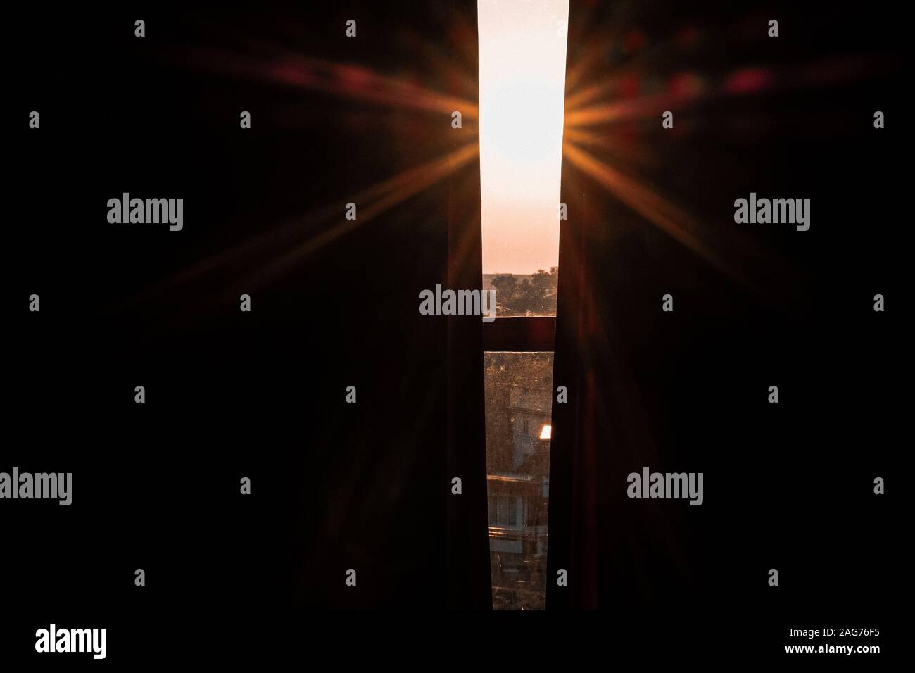 morning sun sunlight light ray through window curtain Stock Photo - Alamy