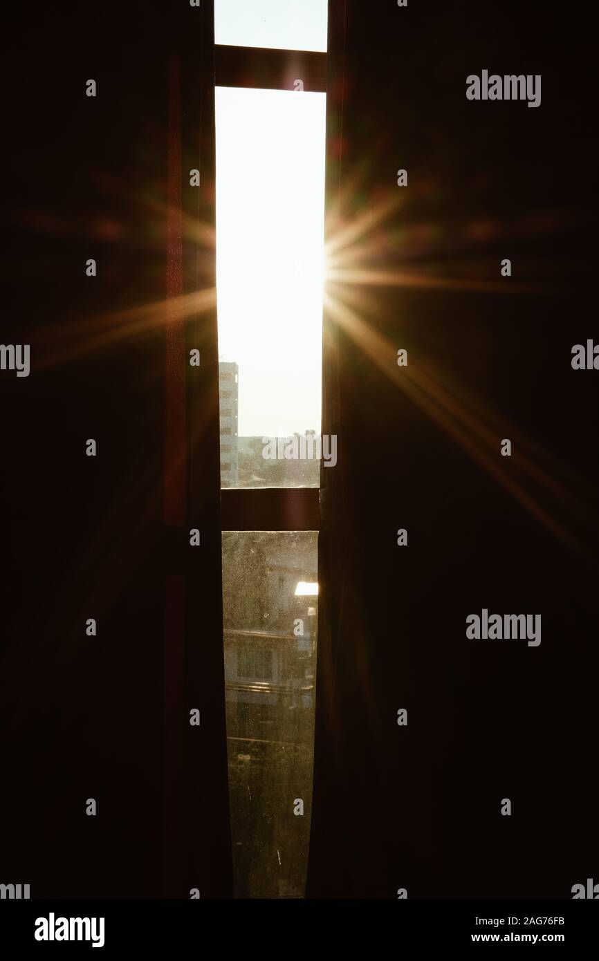 morning sun sunlight light ray through window curtain Stock Photo - Alamy