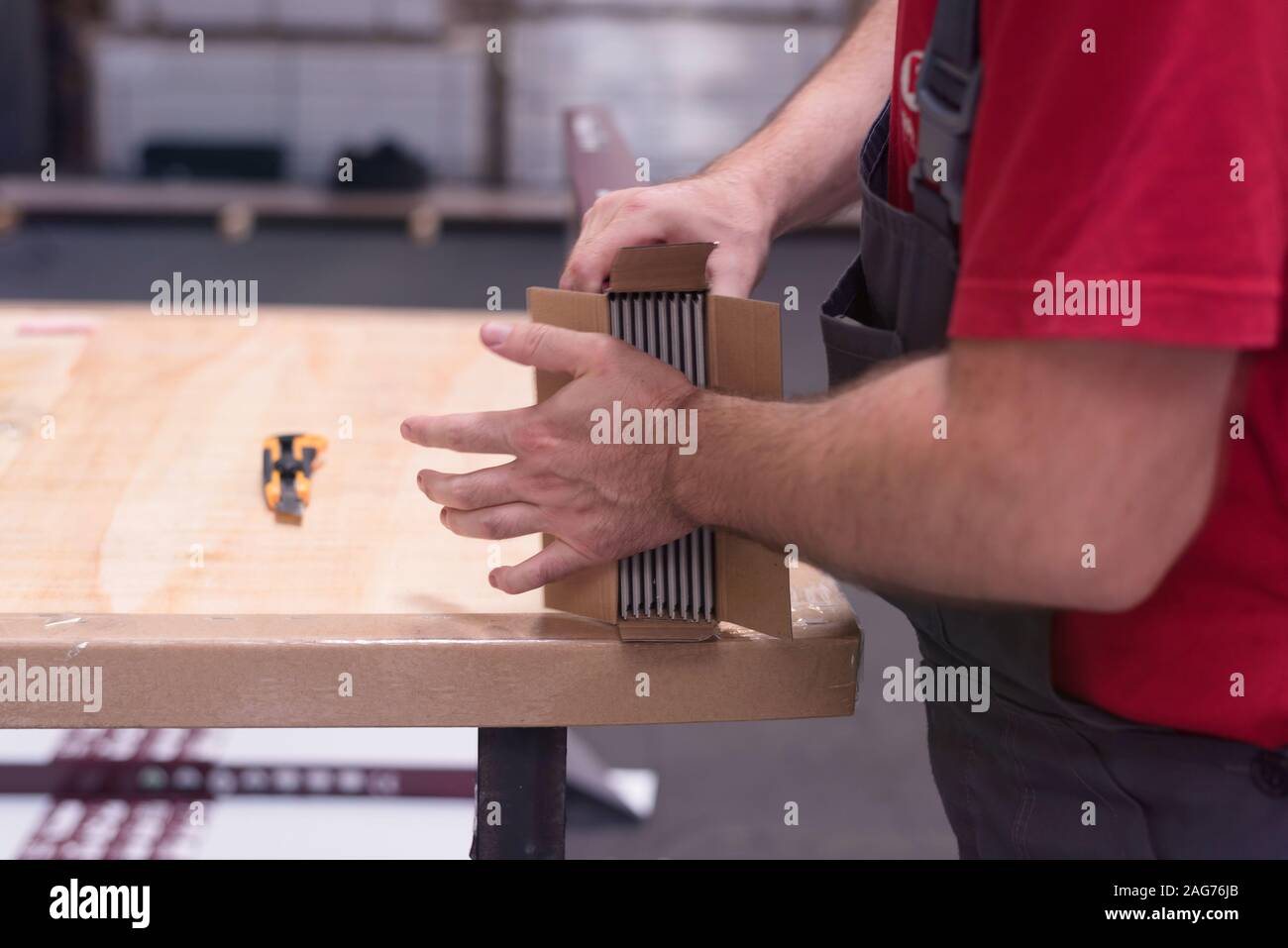 Worker in his carpenter workshop standing proud in front of the ...