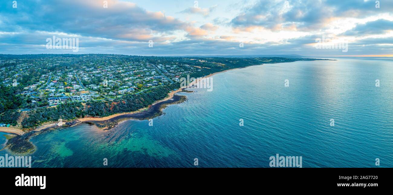 Wide aerial panorama of Mount Eliza suburb and coastline at sunset ...