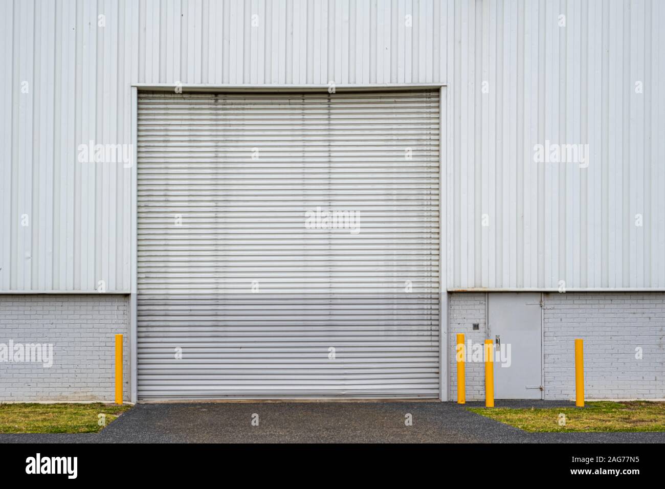 Large warehouse closed white rolling door with copy space Stock Photo ...