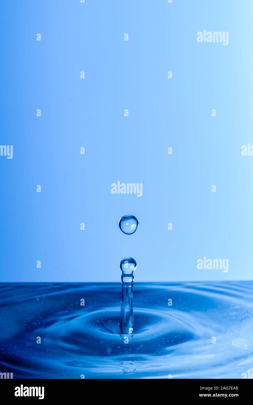 Water drop fall into water Stock Photo - Alamy
