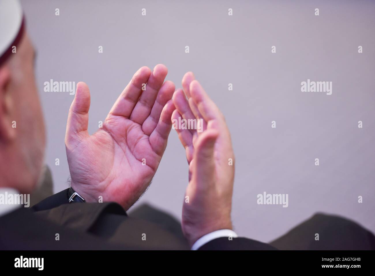 Elderly Muslim Arabic man praying during islamic conference Stock Photo ...
