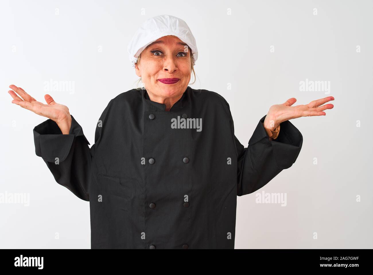Middle age chef woman wearing uniform and cap standing over isolated ...