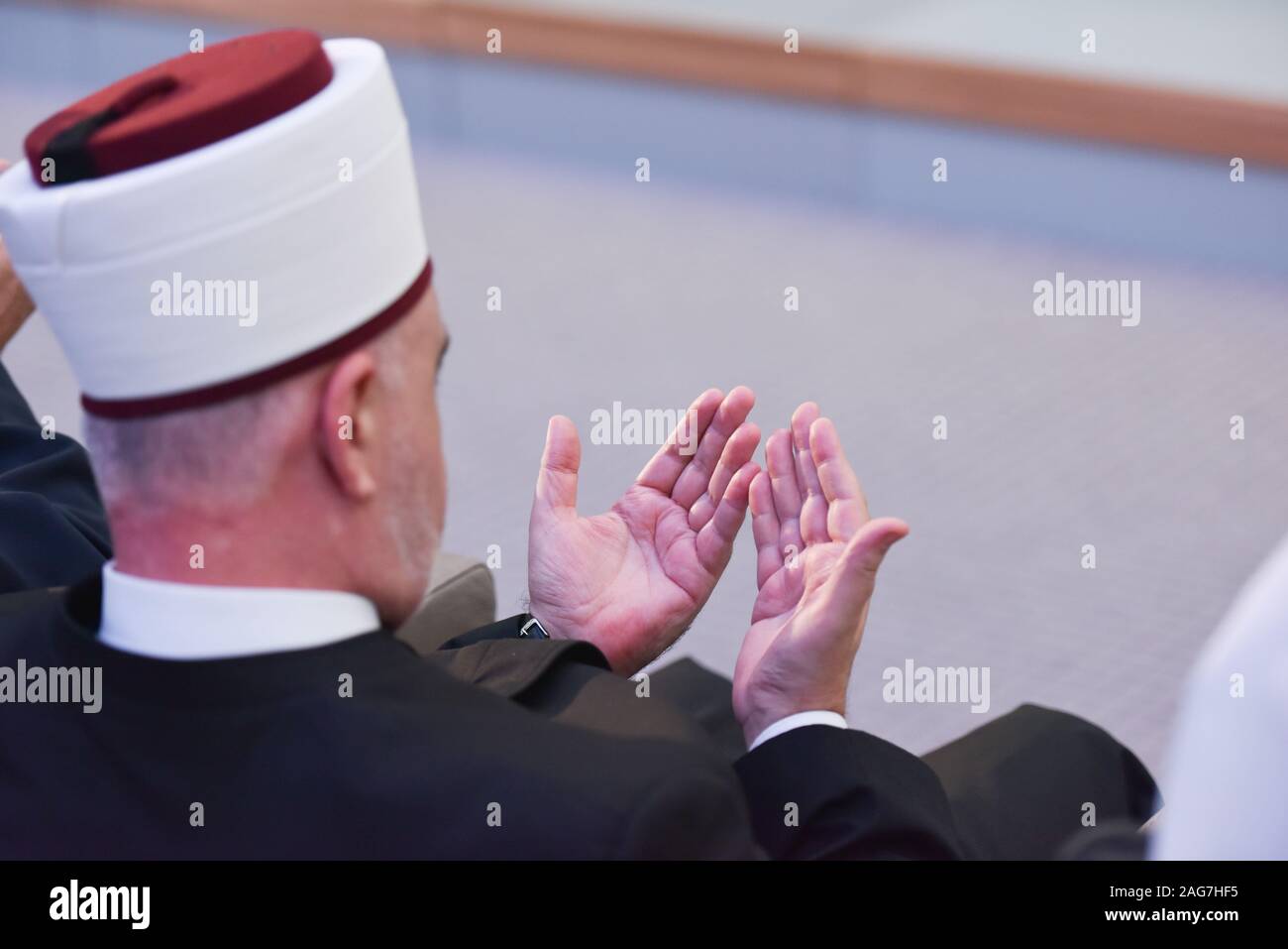 Elderly Muslim Arabic man praying during islamic conference Stock Photo ...