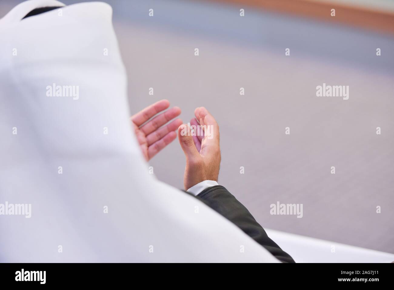 Elderly Muslim Arabic man praying during islamic conference Stock Photo ...