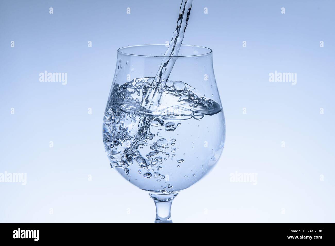 Filling up the water glass from water filter Stock Photo - Alamy