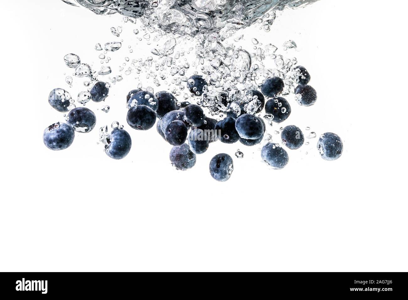 Blueberry’s splashing into crystal water Stock Photo - Alamy