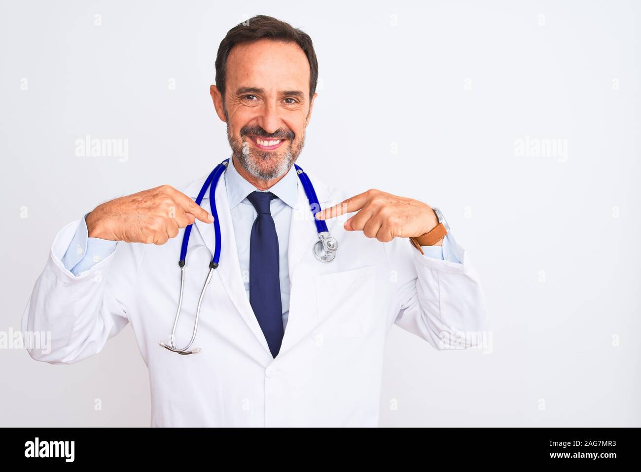 Middle age doctor man wearing coat and stethoscope standing over ...