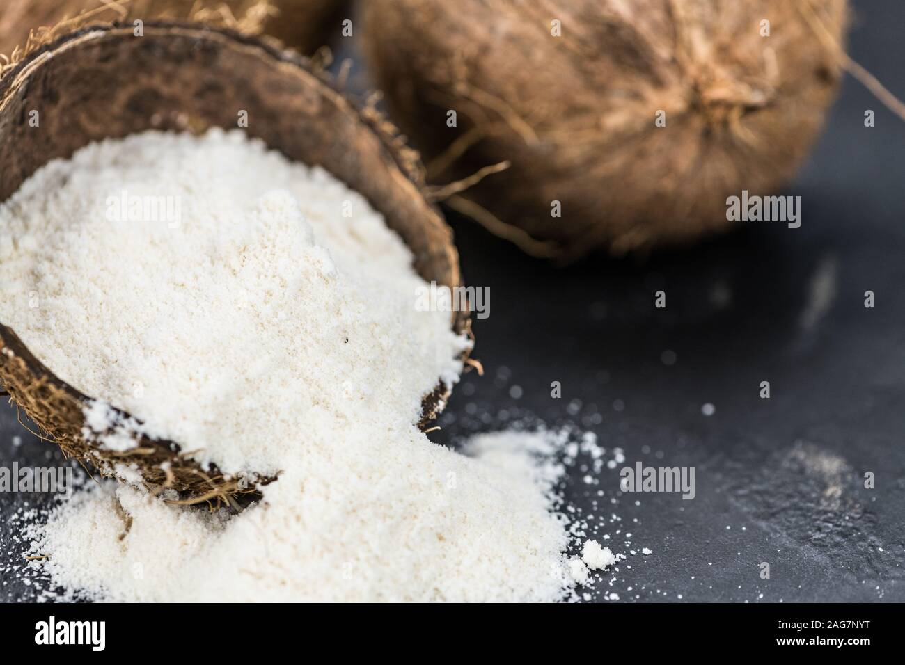 Healthy Coconut flour on a vintage slate slab (close-up shot; selective ...