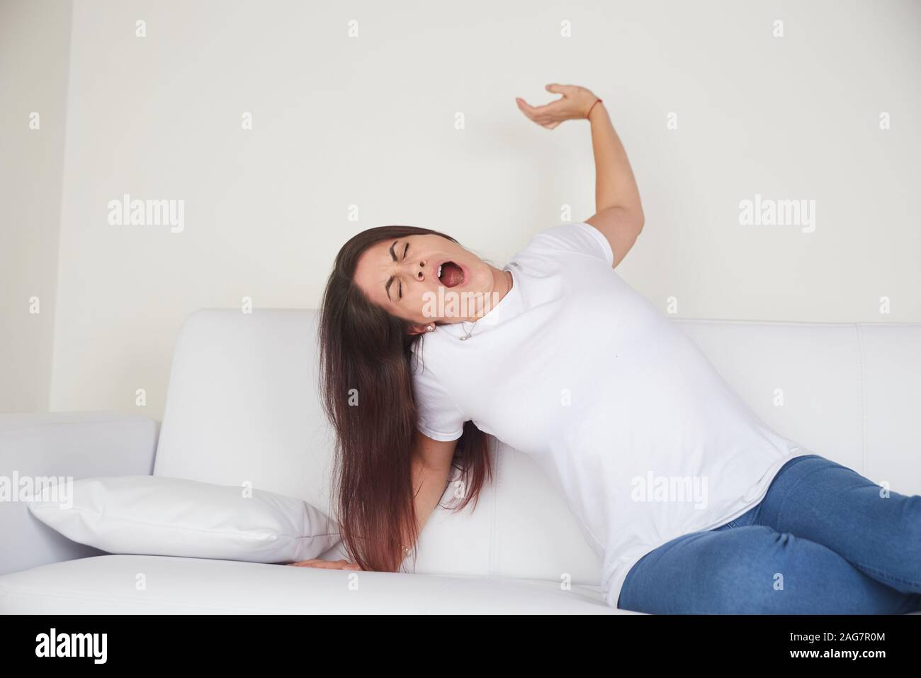 young woman rest on sofa Stock Photo - Alamy
