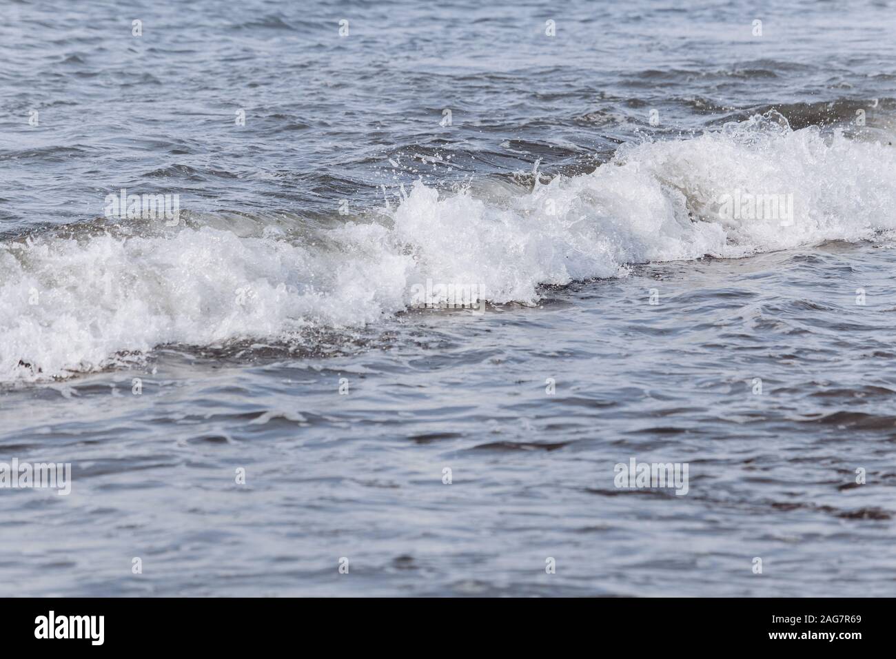 Waves on the beach. A surge of water ashore Stock Photo - Alamy