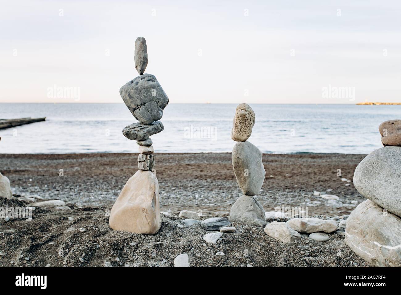 Figures of stones on the beach near the sea. Sea background and stone ...