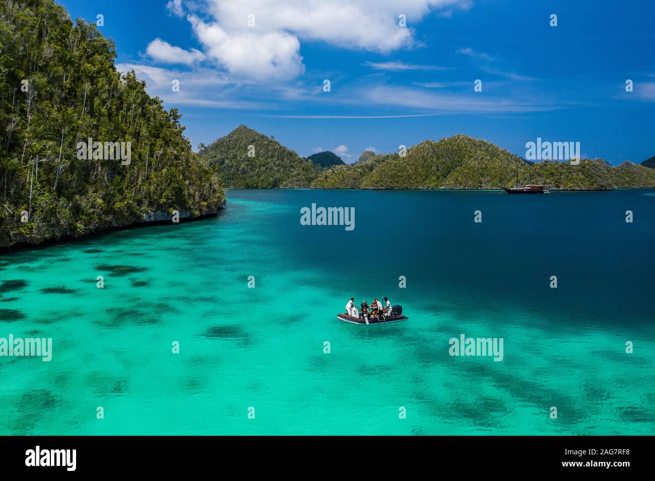 Diving tender boat in tropical water Raja Ampat Indonesia Stock Photo ...
