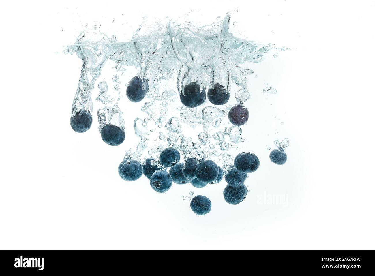 Blueberries falling into water Stock Photo - Alamy