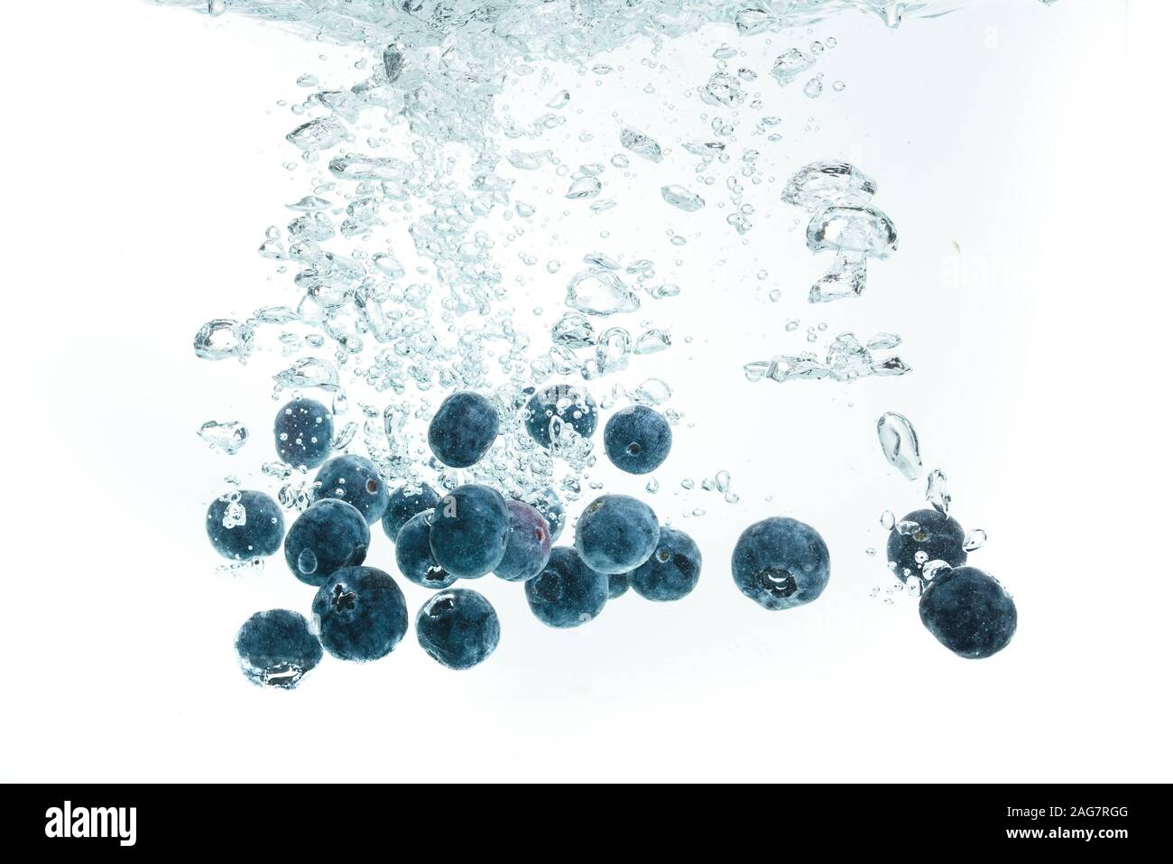 Blueberries falling into water Stock Photo - Alamy
