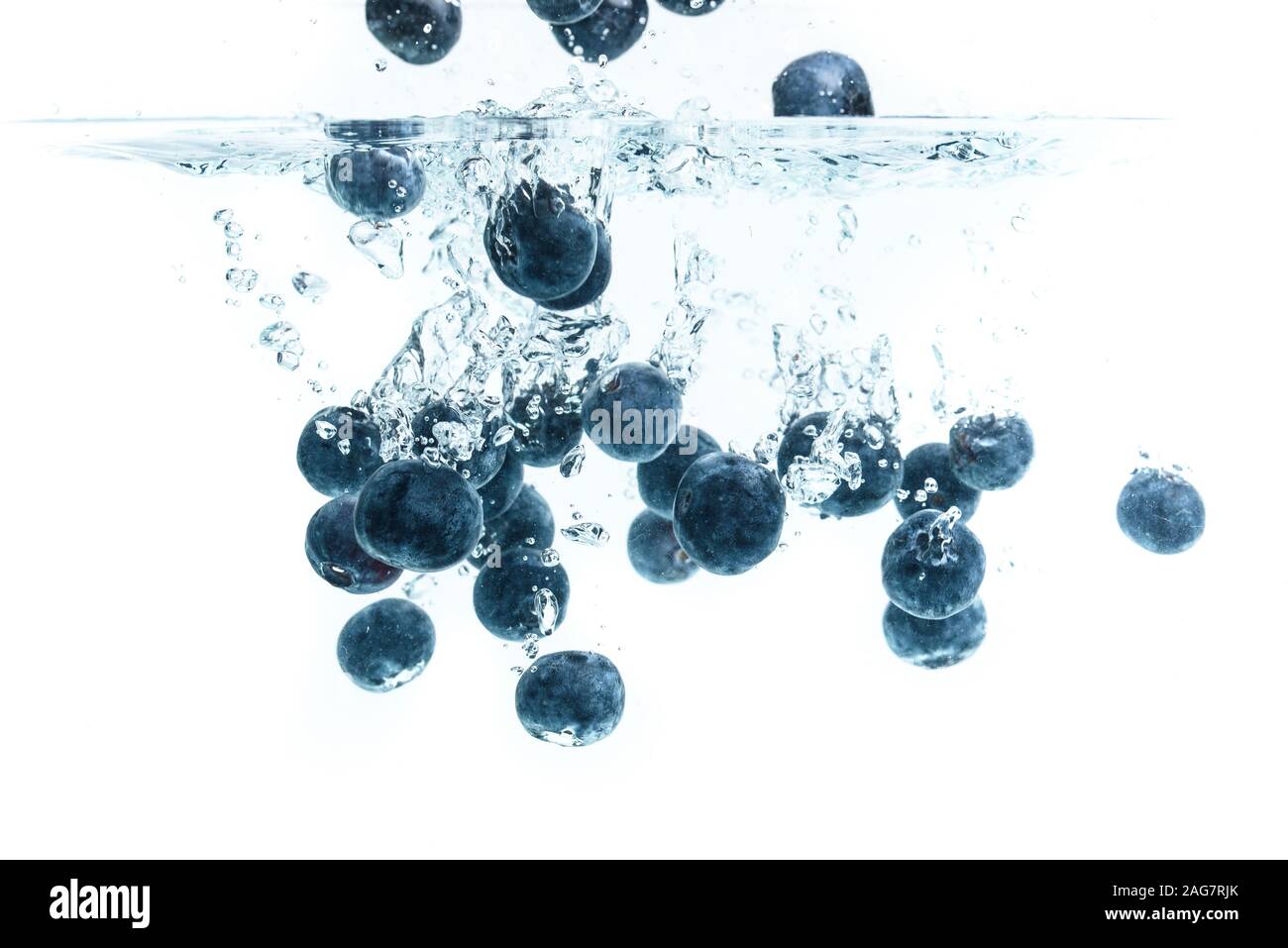 Blueberries falling into water Stock Photo - Alamy