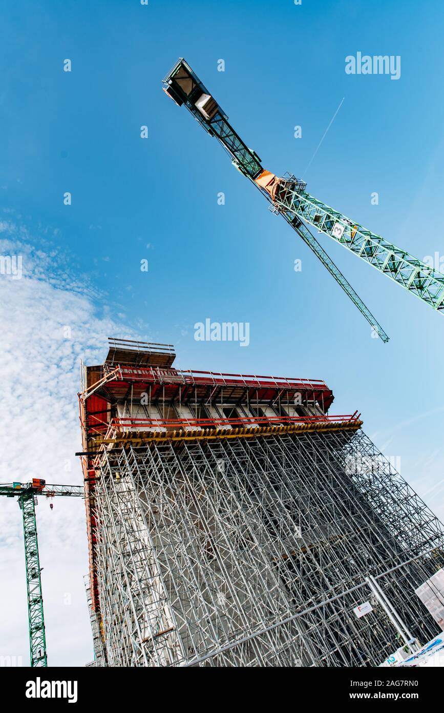 Construction of multi-storey building with cranes Stock Photo - Alamy