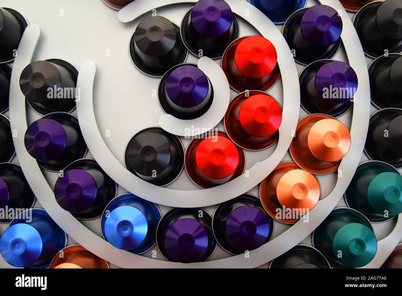 Coffee colored capsules in their display Stock Photo - Alamy