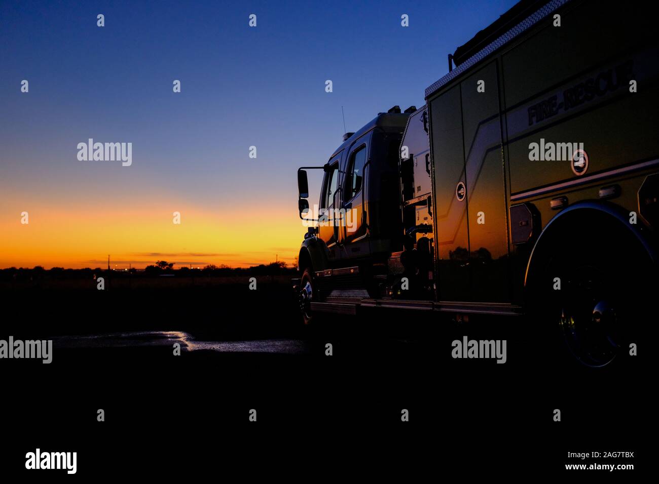 Yellow fire truck under the beautiful sunset sky Stock Photo - Alamy