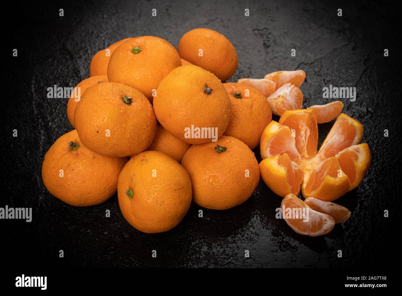Juicy mandarin on black background. Mandarin Fruit Stock Photo - Alamy
