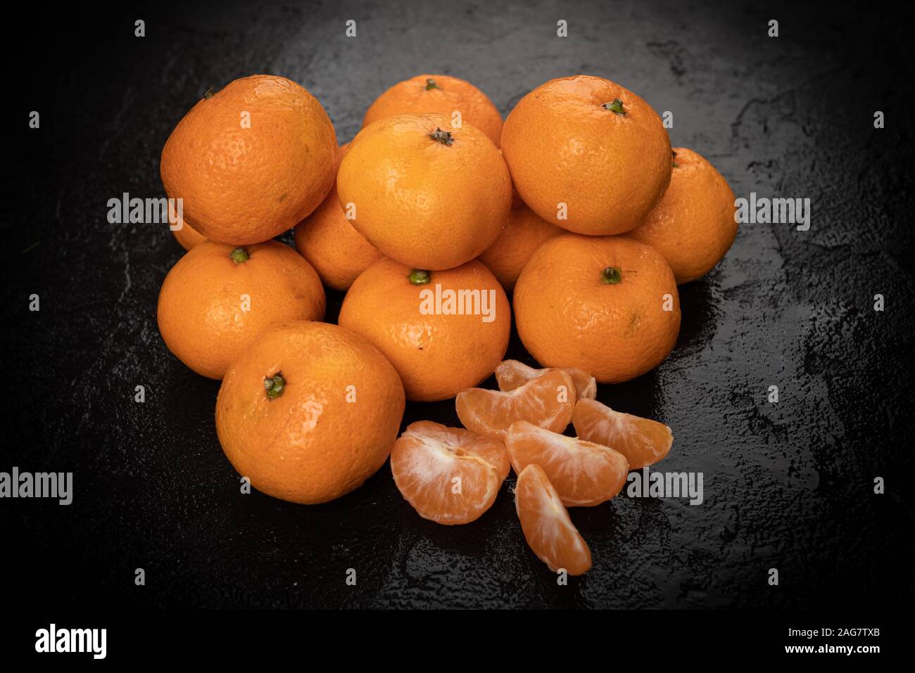 Juicy mandarin on black background. Mandarin Fruit Stock Photo - Alamy