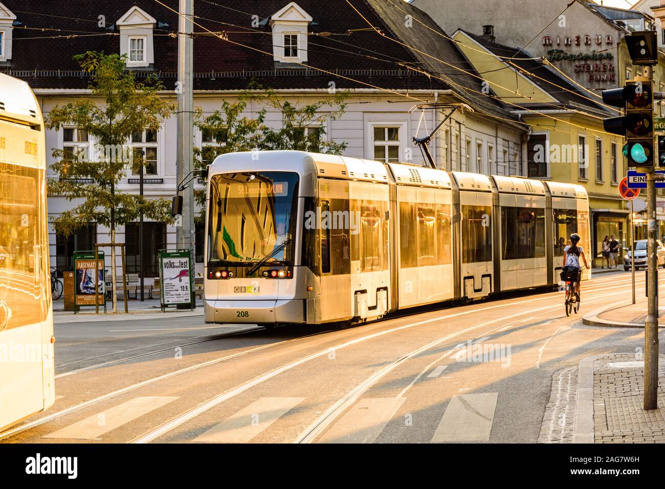 Graz city street sun setting tram Stock Photo - Alamy