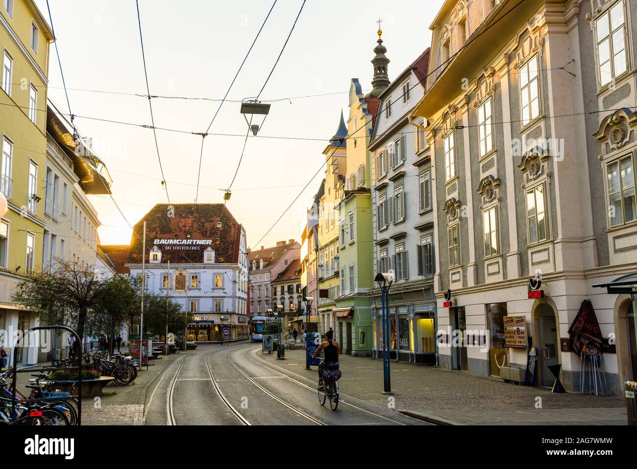 Graz city street sun setting behind building Stock Photo - Alamy