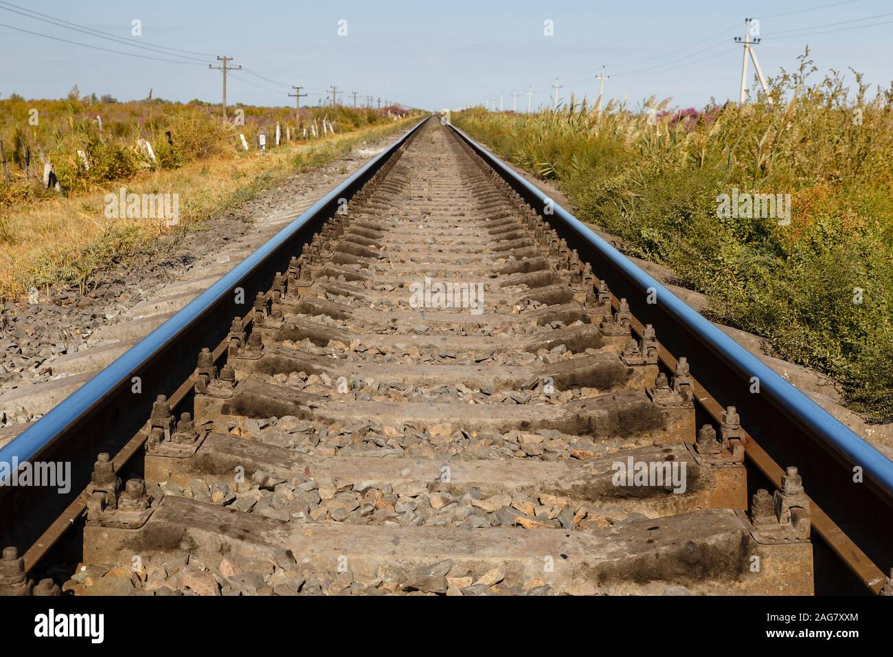 single-track railway line, rails and sleepers, railway track in ...
