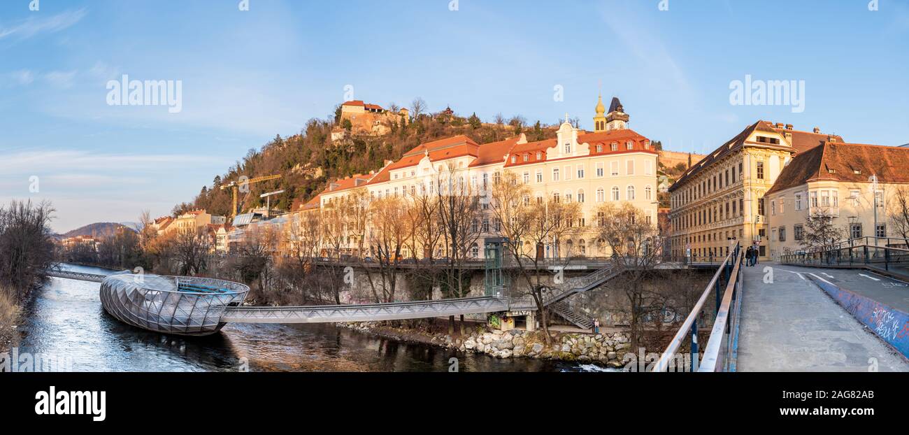 Panorama view at Mur river, Murinsel on bridge, Schlossberg hill with ...