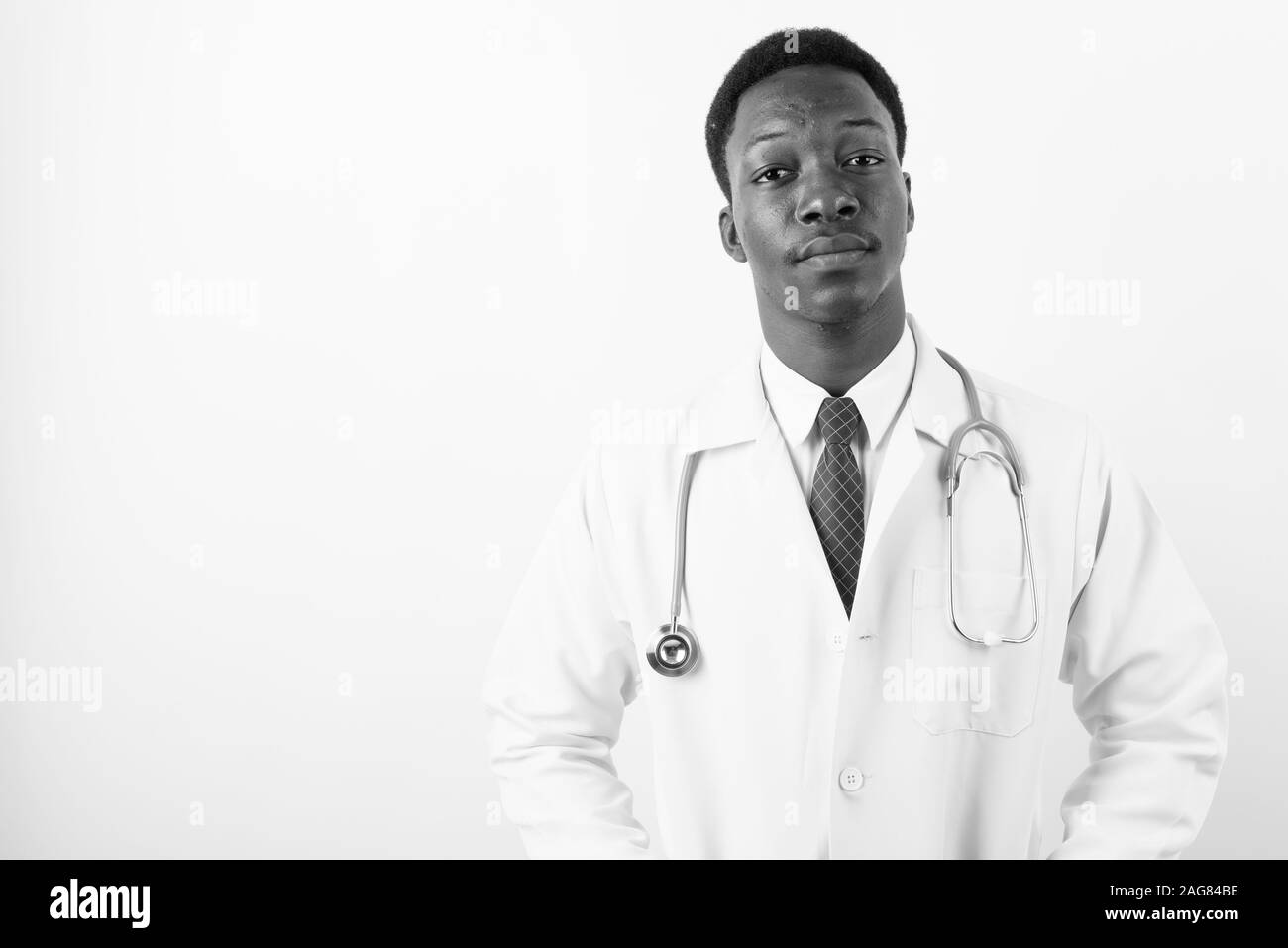 Young handsome African man doctor against white background Stock Photo ...