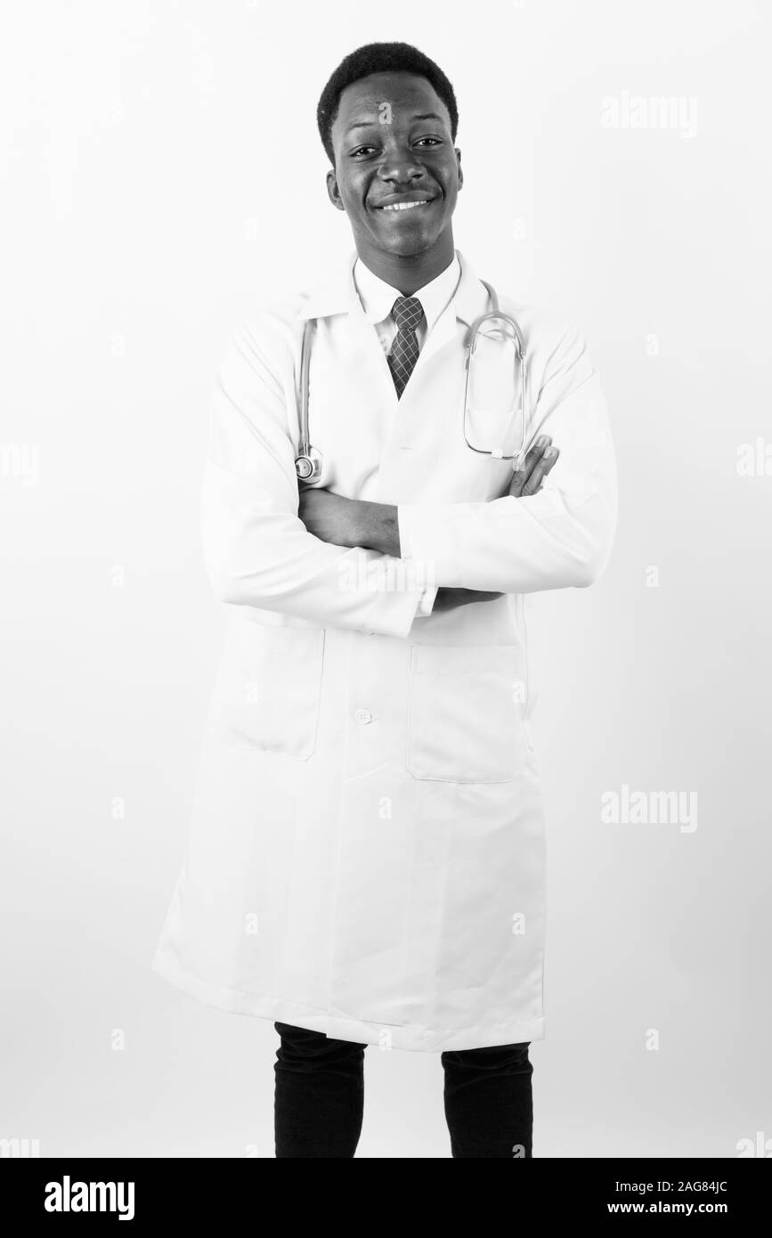 Young handsome African man doctor against white background Stock Photo ...