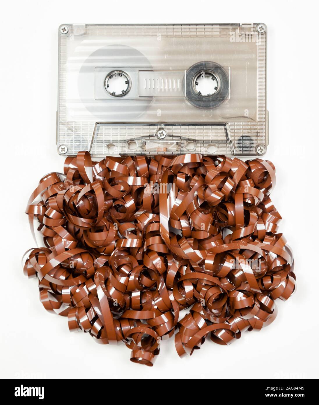 Vintage transparent Compact Cassette with pulled out tape on white ...