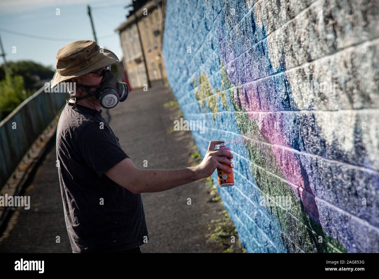 Ebbw Vale, UK - September 13, 2019: Graffiti artist painting building ...