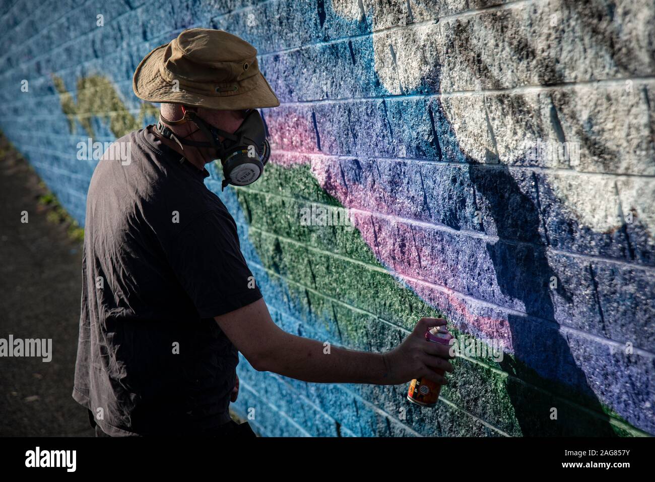 Ebbw Vale, UK - September 13, 2019: Graffiti artist painting building ...