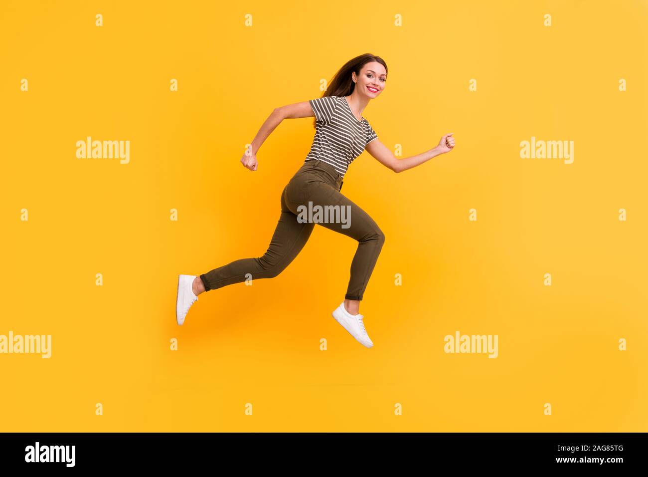 Full size profile side photo of excited enthusiastic girl jump run fast ...